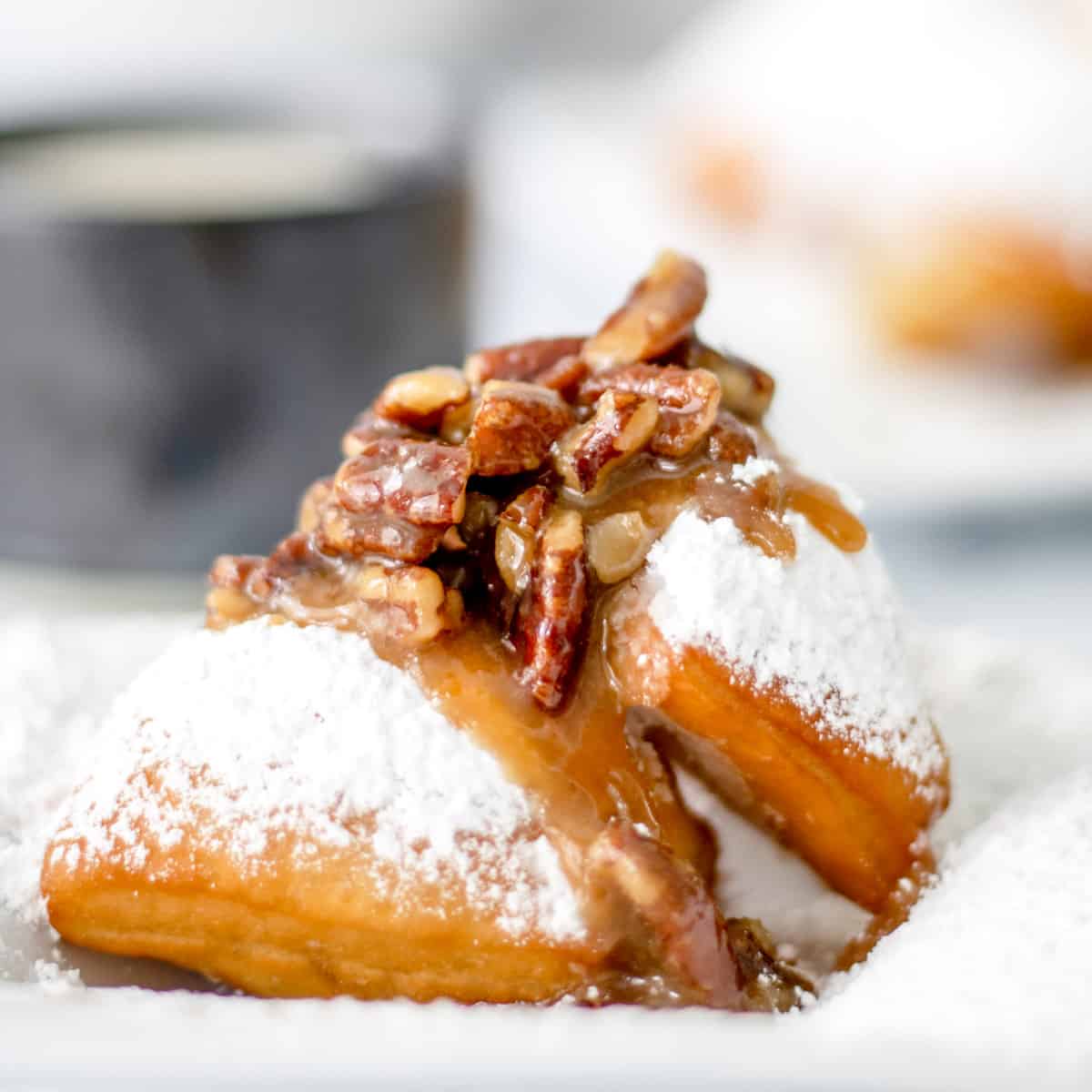 Beignets with Pecan Praline Sauce Recipe • State of Dinner